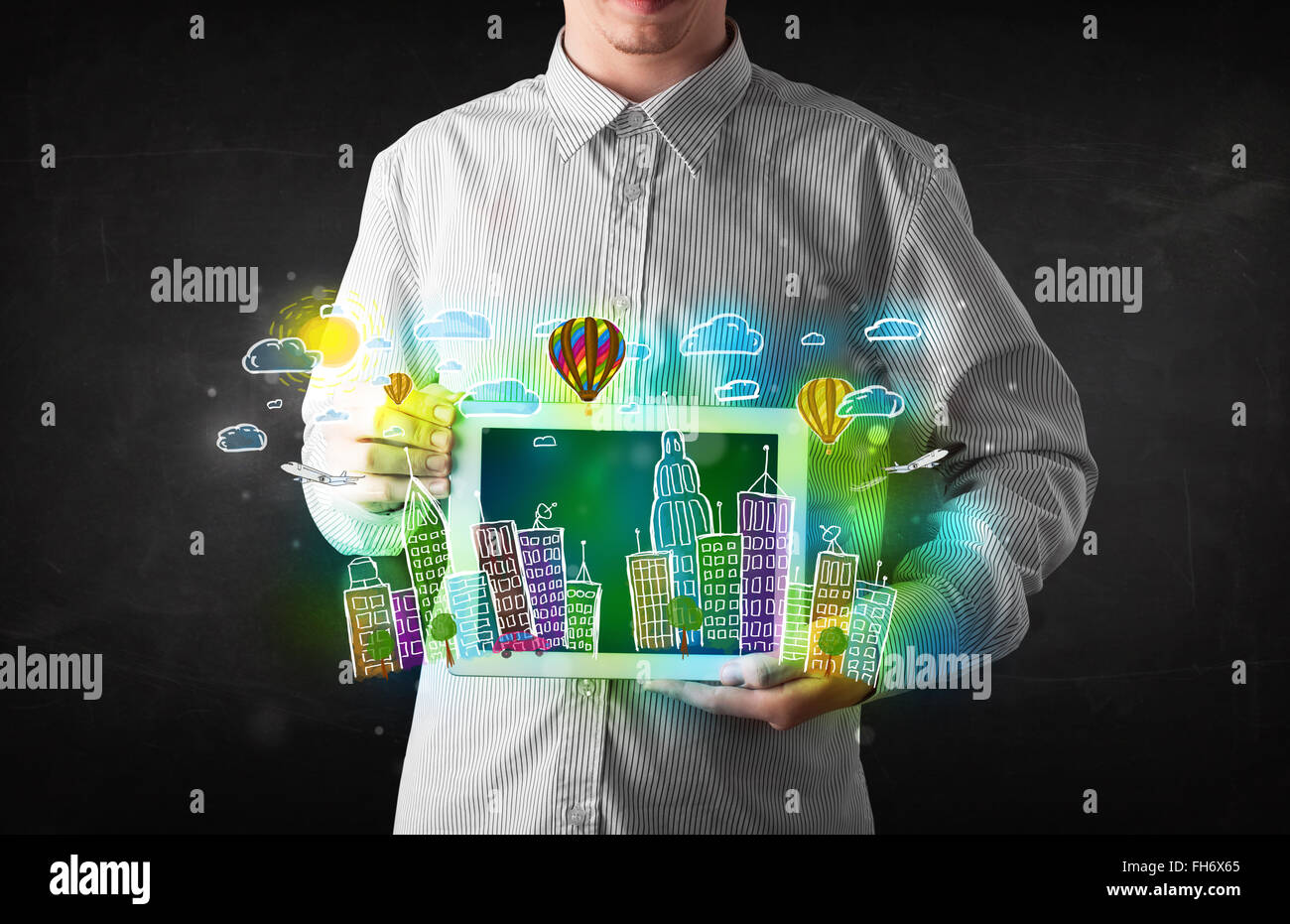 Young person showing tablet with hand drawn cityscape Stock Photo - Alamy