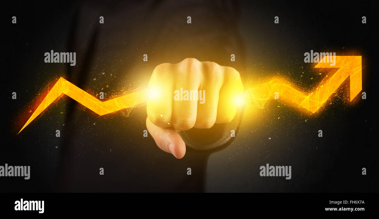 Business person holding a hot glowing upright arrow Stock Photo - Alamy