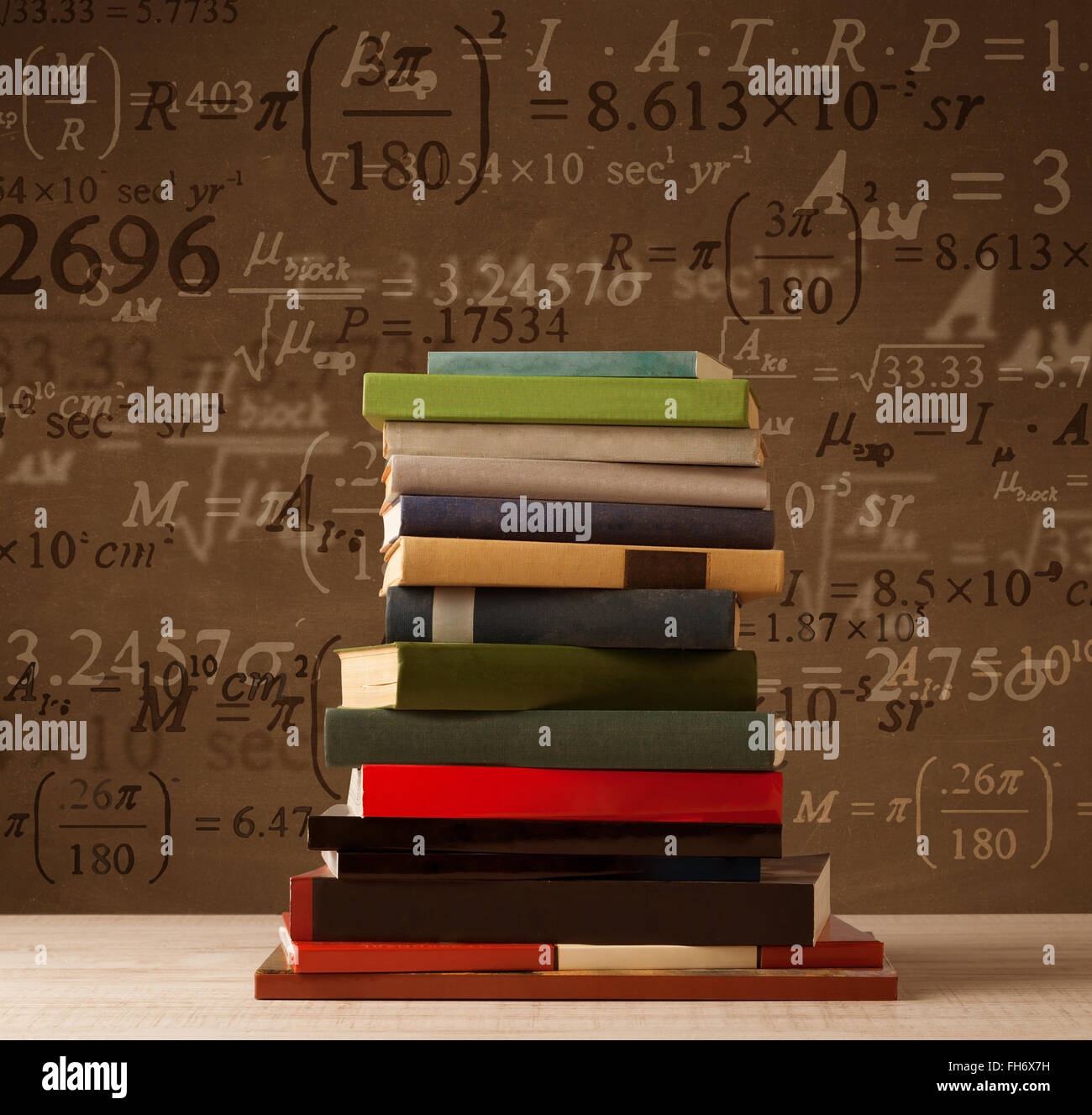 Books on vintage background with math formulas Stock Photo - Alamy