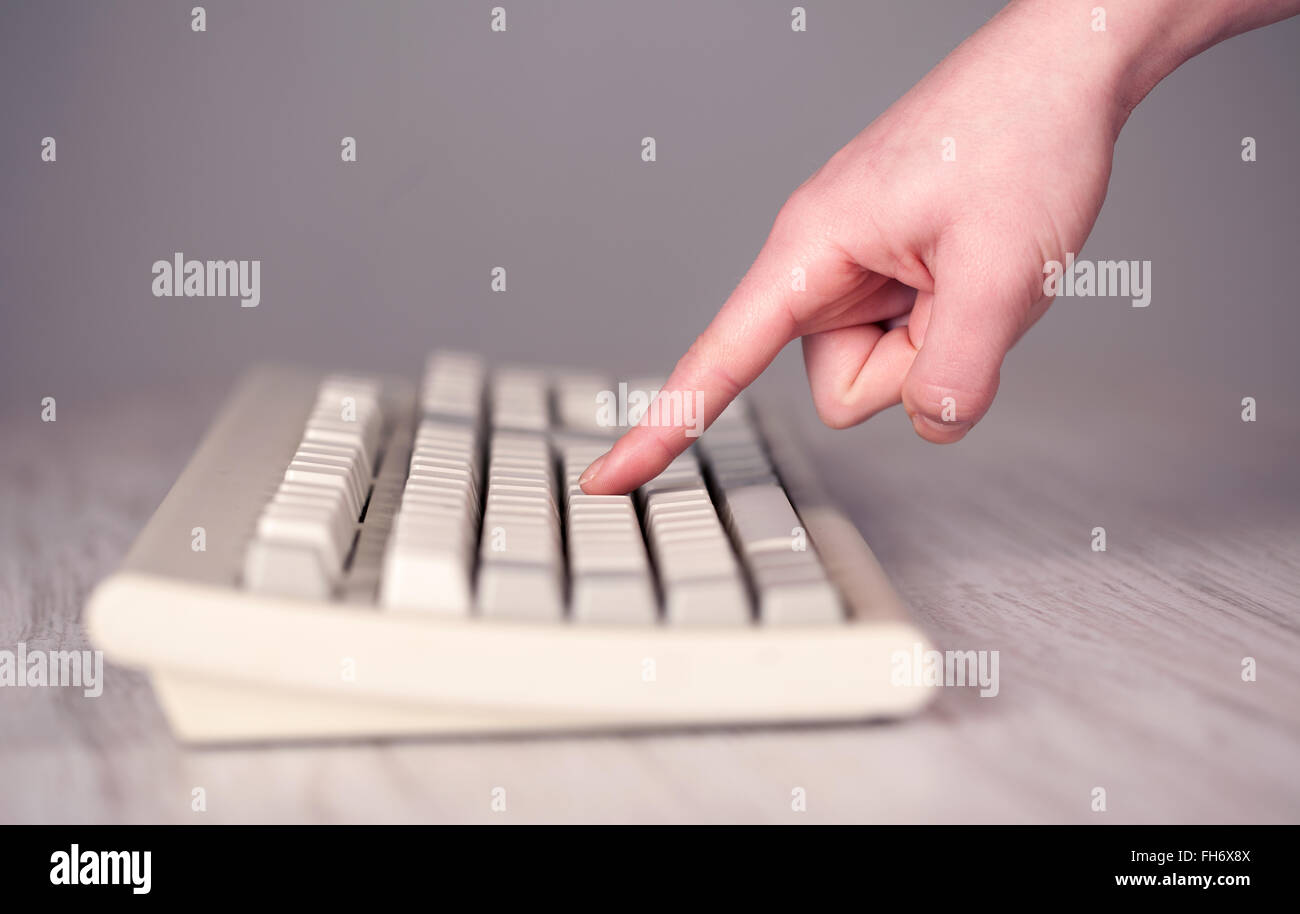 Close up of hand pressing keyboard buttons Stock Photo - Alamy