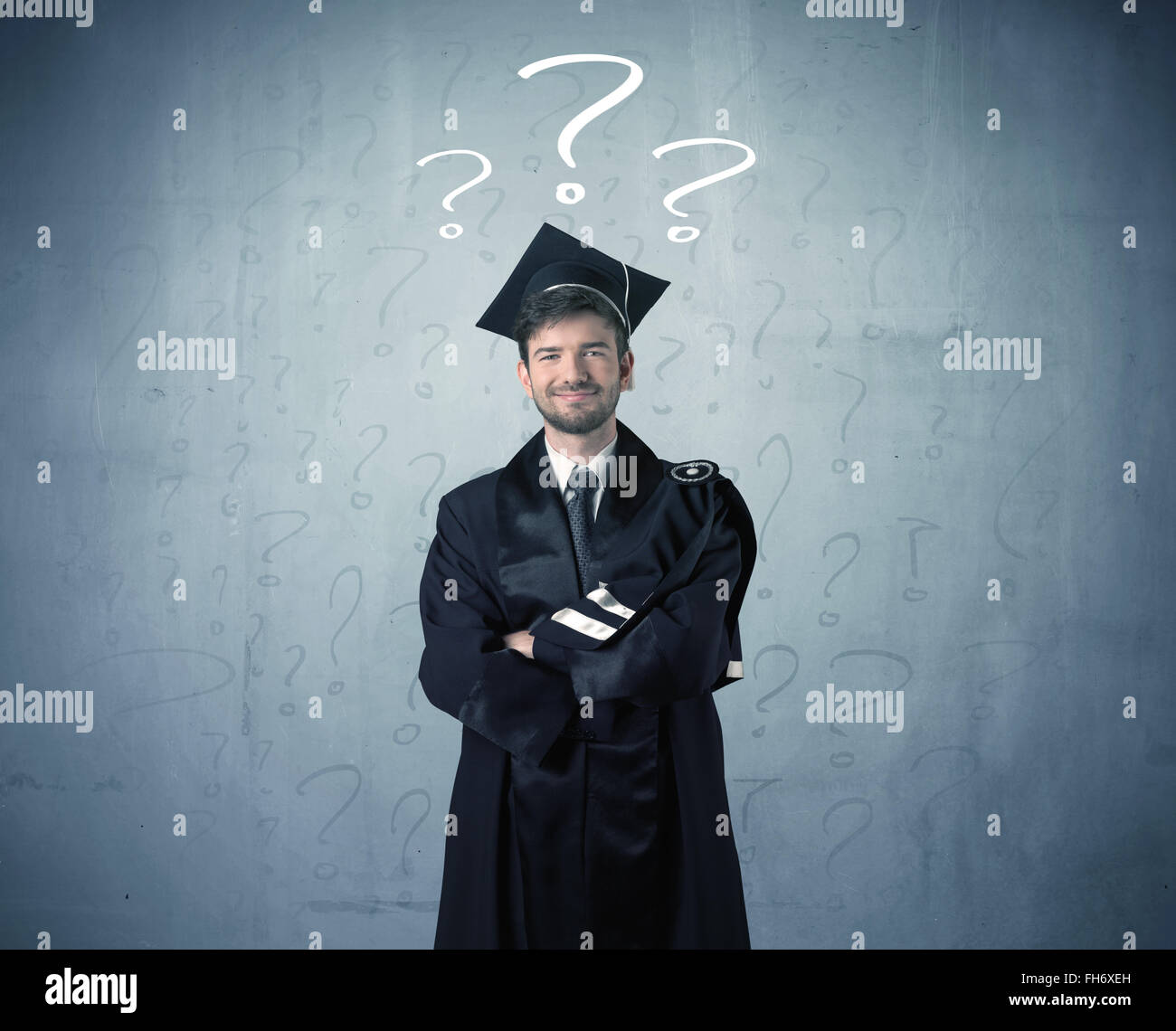 Young graduate teenager with question marks drawn Stock Photo - Alamy