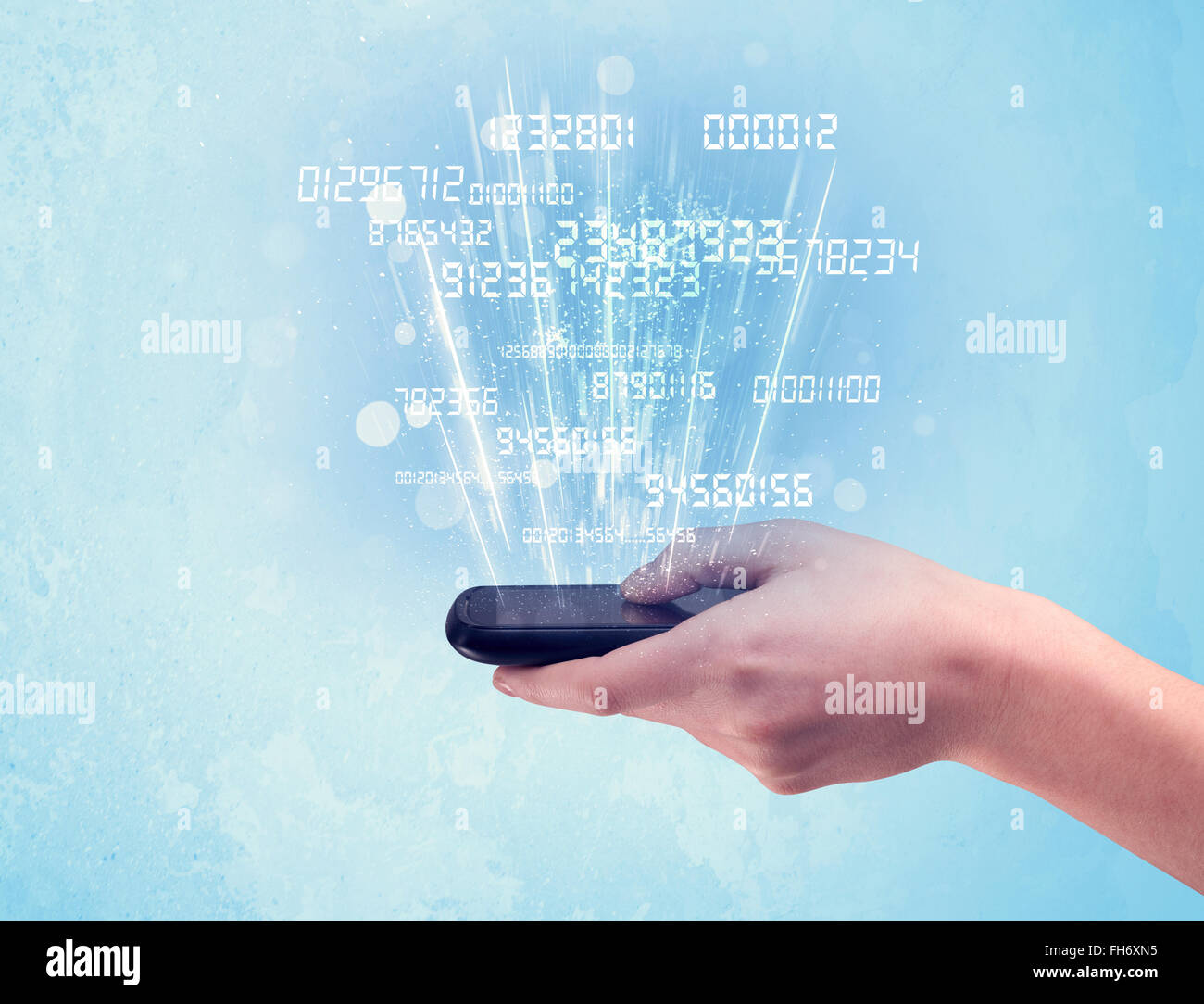 Hand holding phone with digital numbers Stock Photo - Alamy