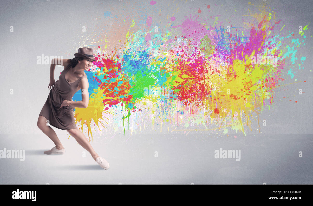Young colorful street dancer with paint splash Stock Photo - Alamy