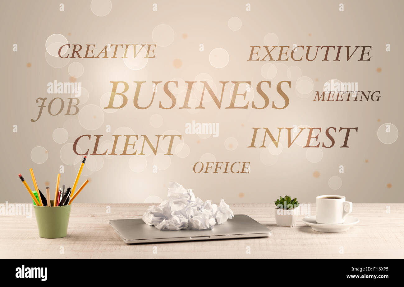 Business office desk with writing on wall Stock Photo - Alamy