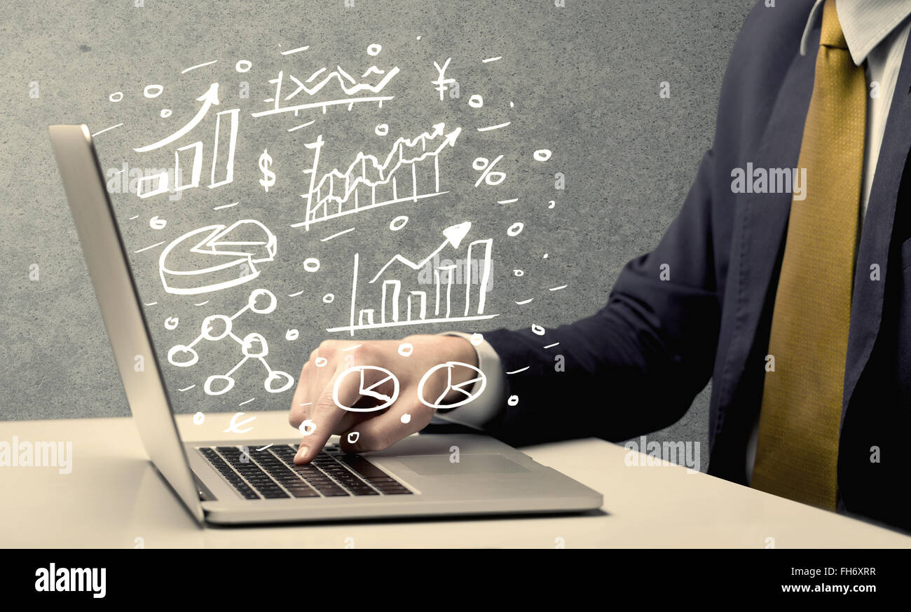 Business man drawing charts with laptop Stock Photo - Alamy