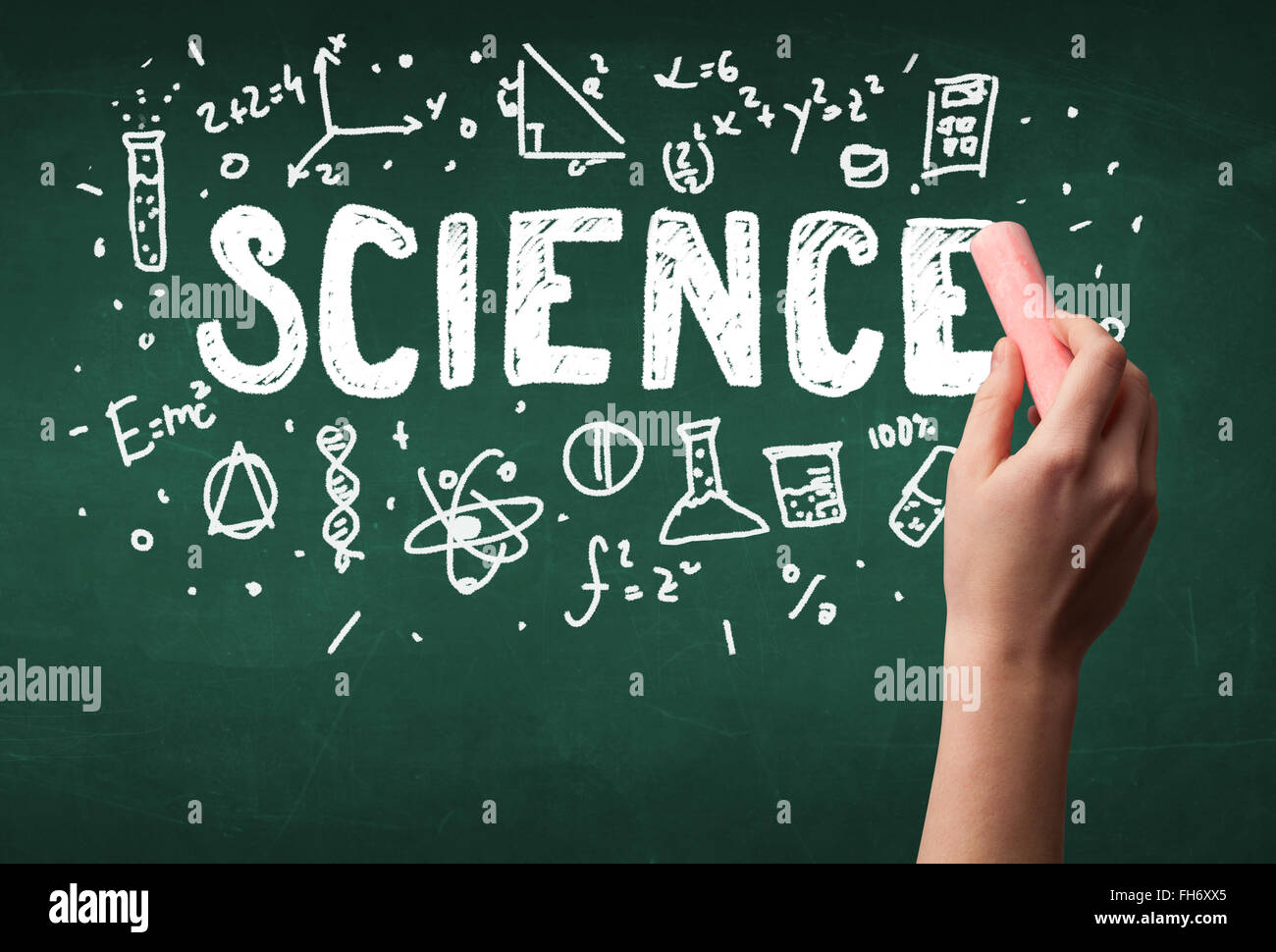 Mature science person drawing on board Stock Photo - Alamy