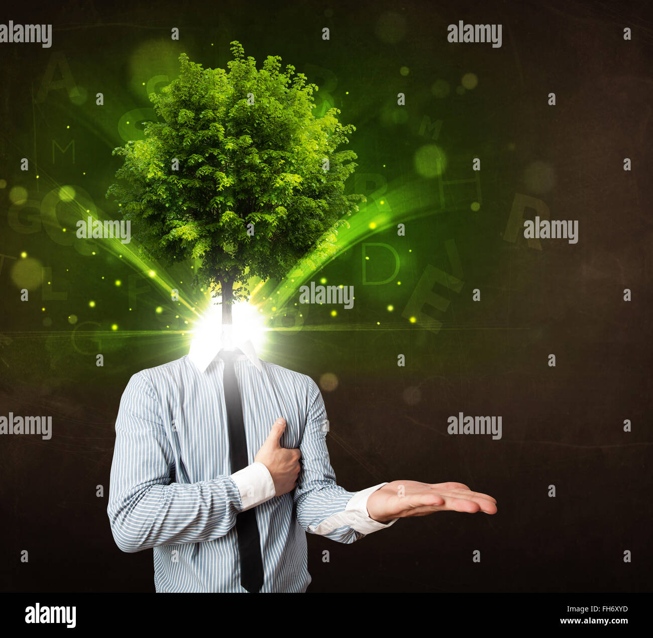 Man with green tree head concept Stock Photo - Alamy