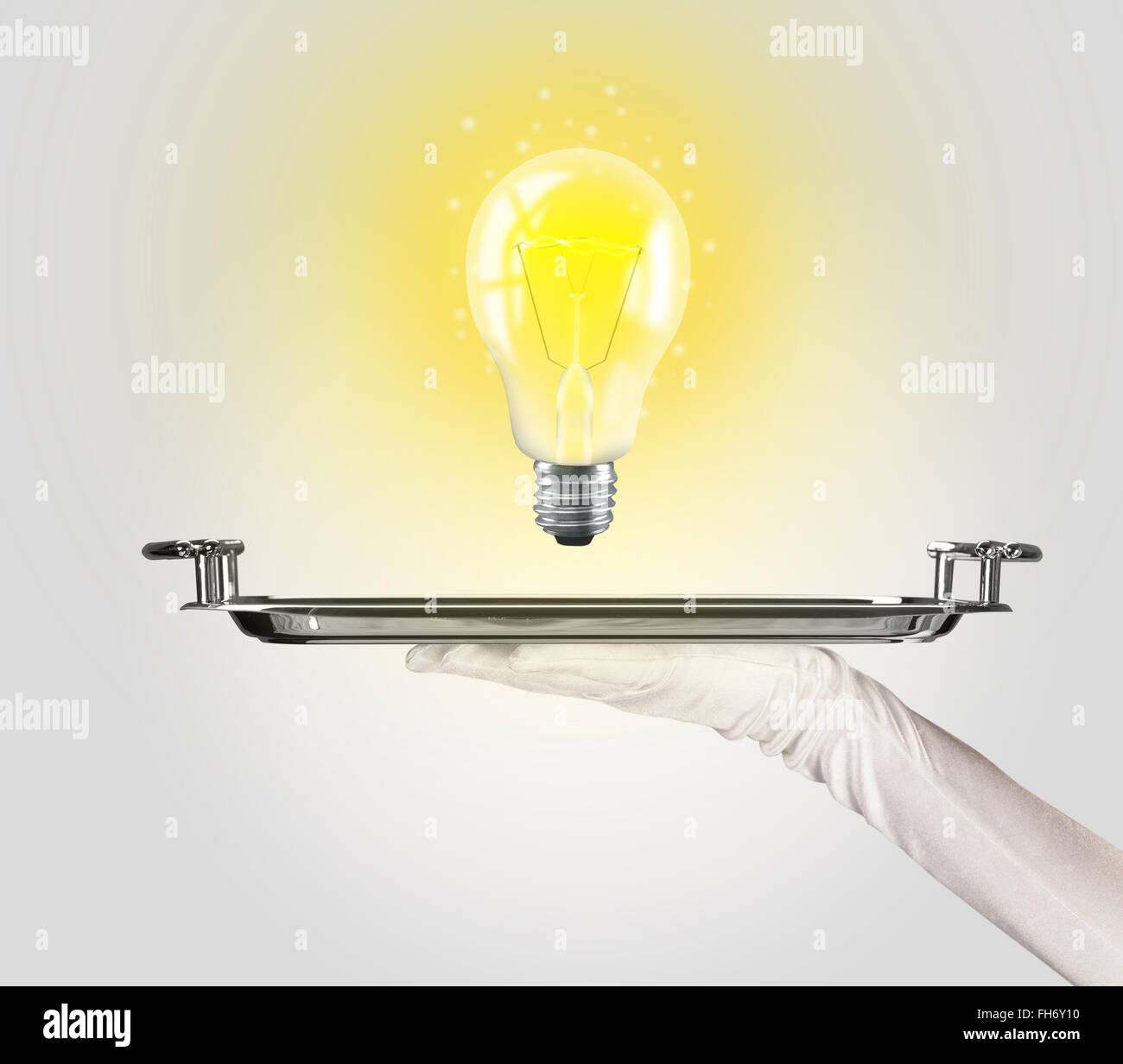 Clever idea concept with bulb on tray Stock Photo - Alamy