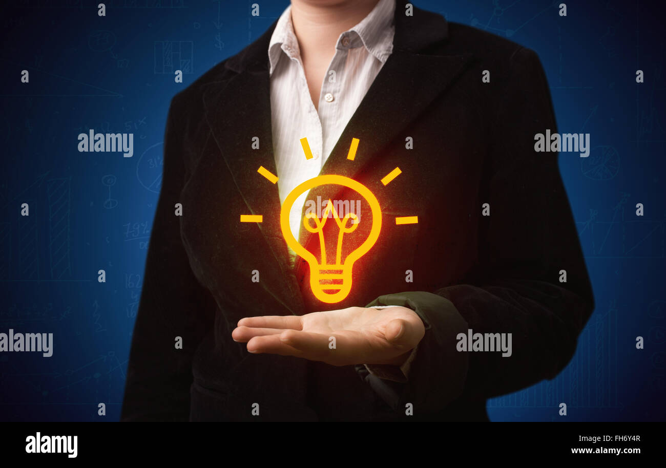 Sales guy has bright idea in the hand Stock Photo - Alamy