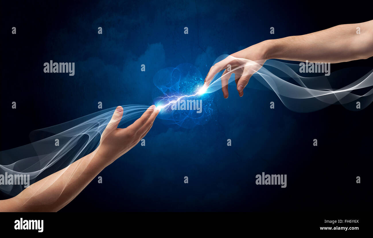 Hands connecting through fingers in space Stock Photo - Alamy