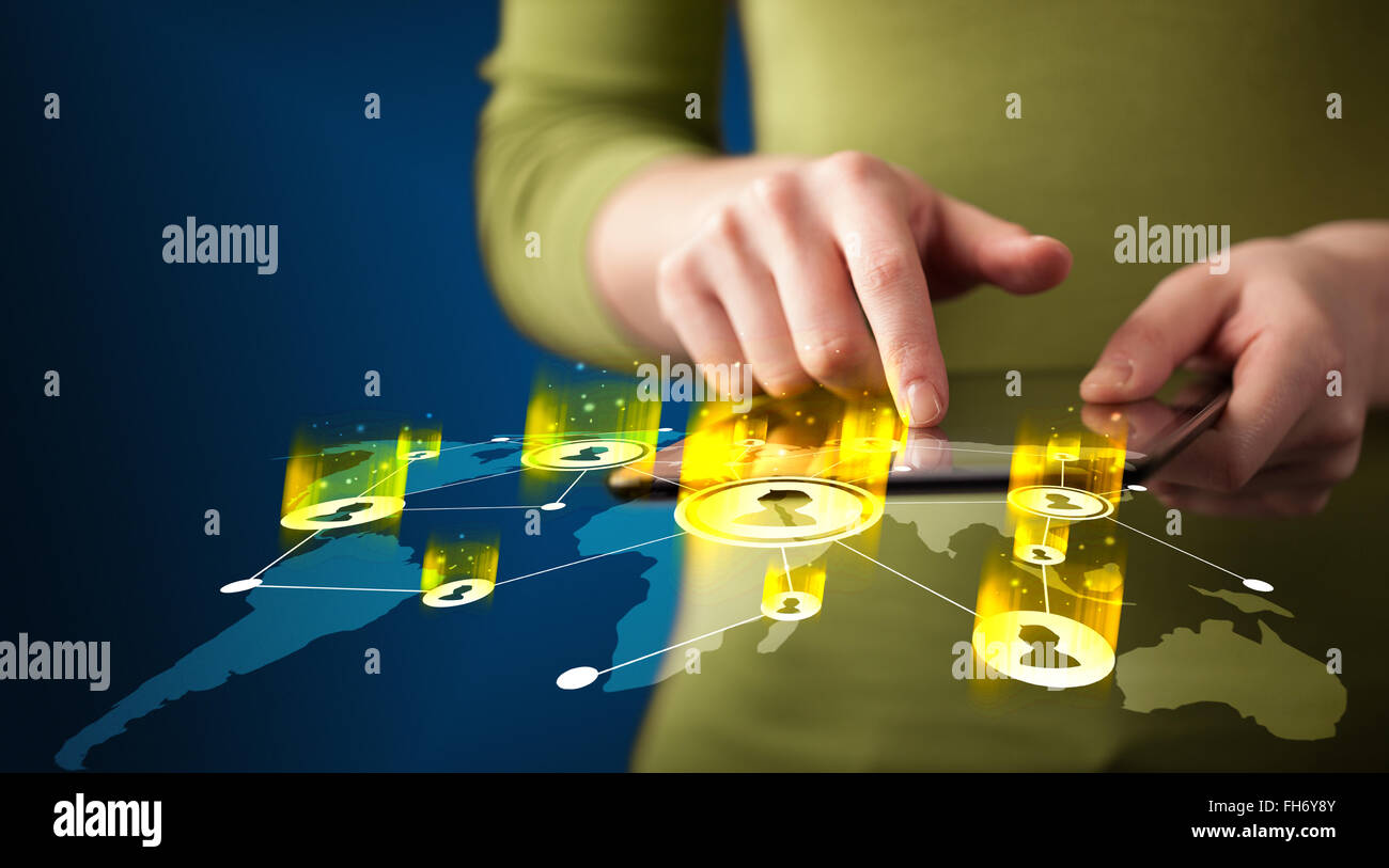 Hand holding tablet device with social network map Stock Photo - Alamy