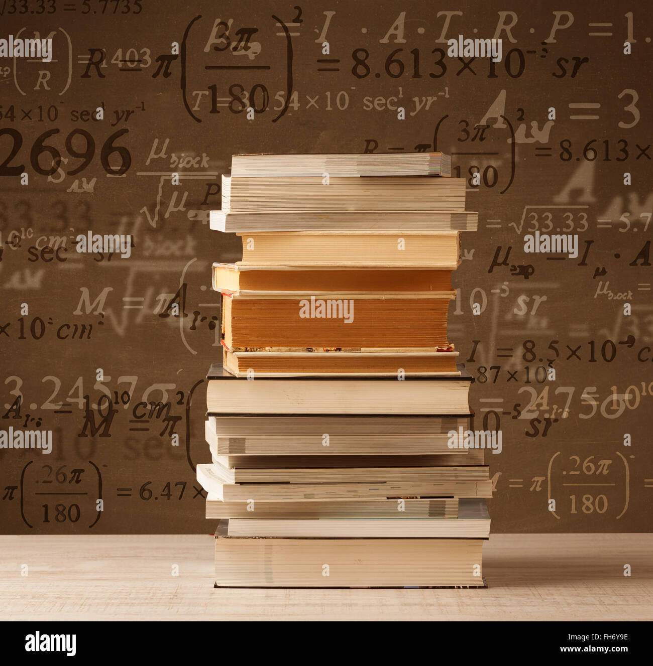 Books on vintage background with math formulas Stock Photo - Alamy