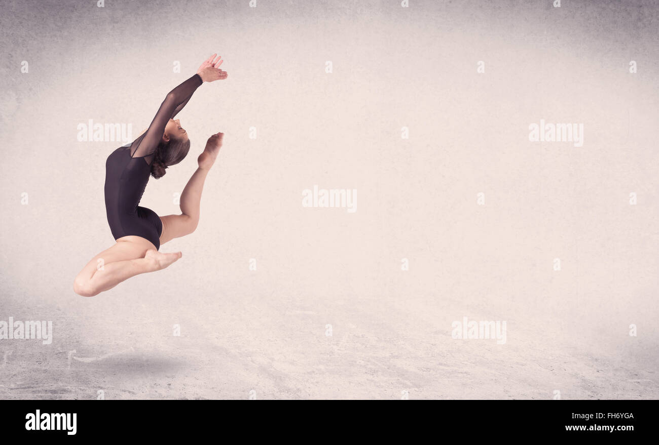 Modern ballet dancer performing art jump with empty background Stock ...