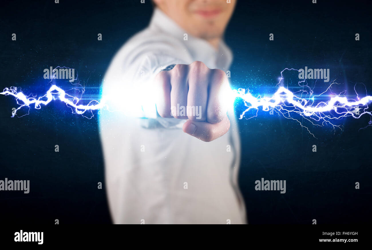 Business man holding electricity light bolt in his hands Stock Photo ...