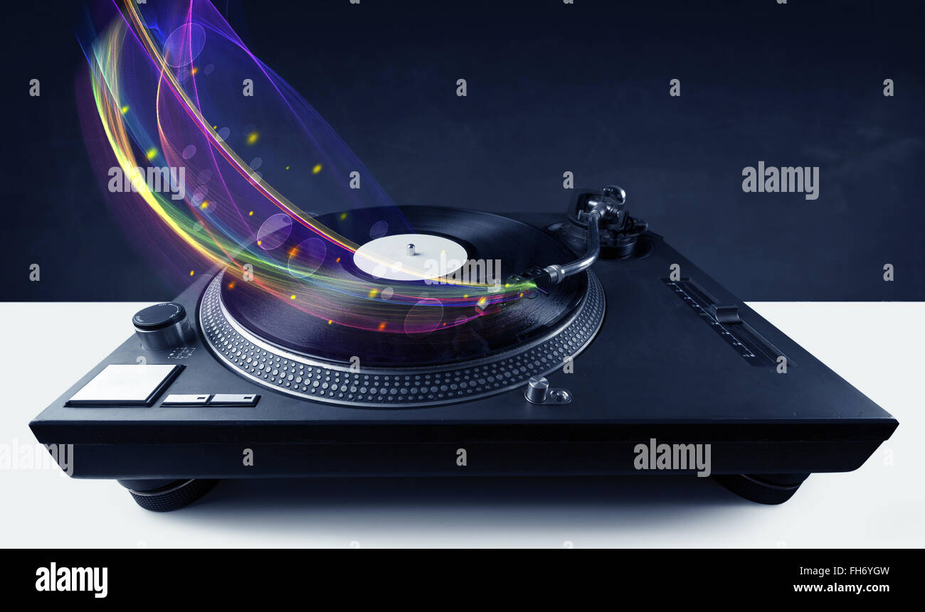 Turntable playing vinyl with glowing abstract lines Stock Photo - Alamy