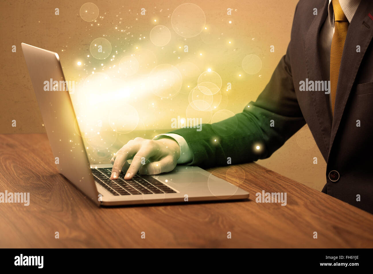 Businessman working fast on laptop Stock Photo - Alamy