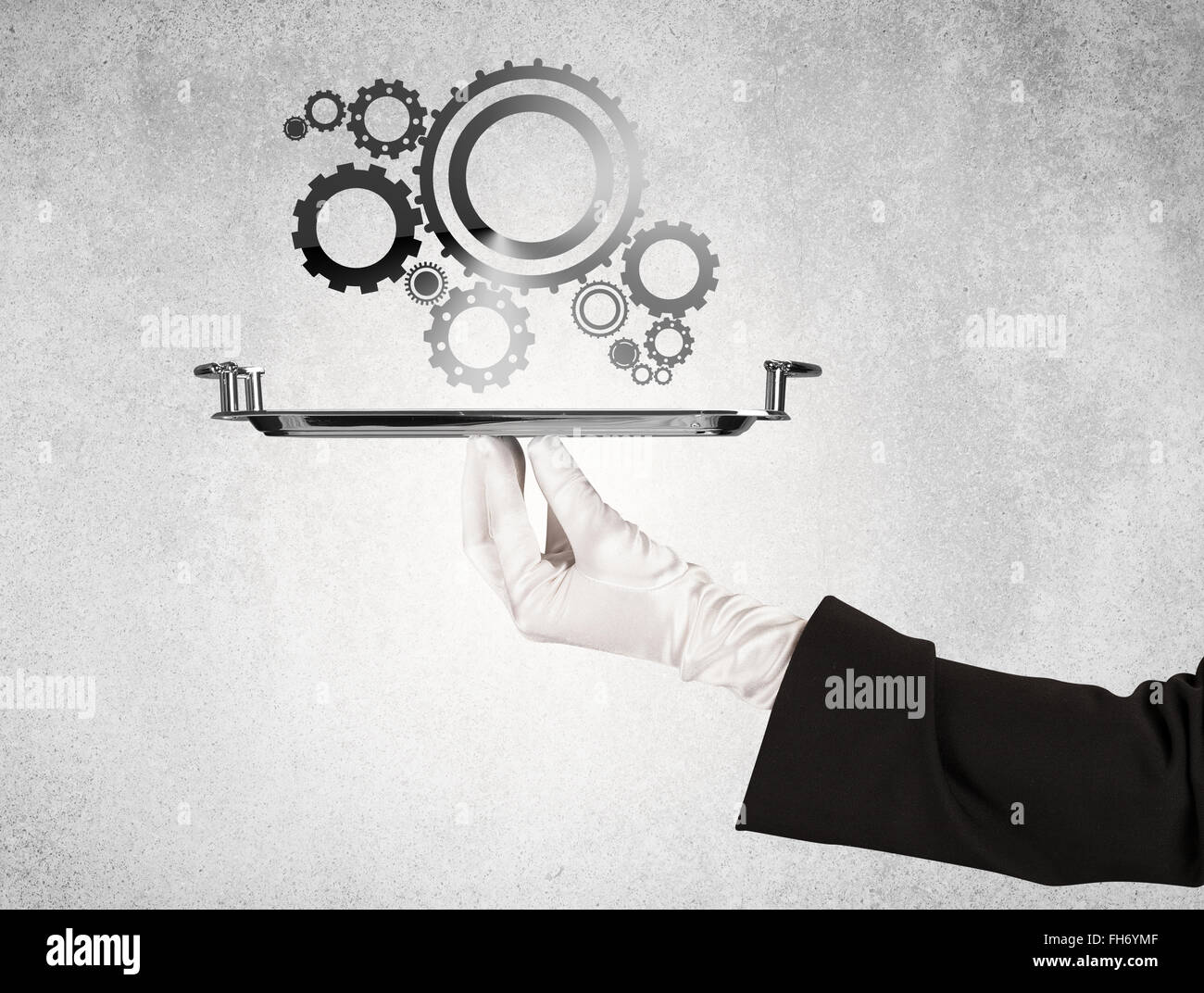Working cog wheel concept on tray Stock Photo - Alamy
