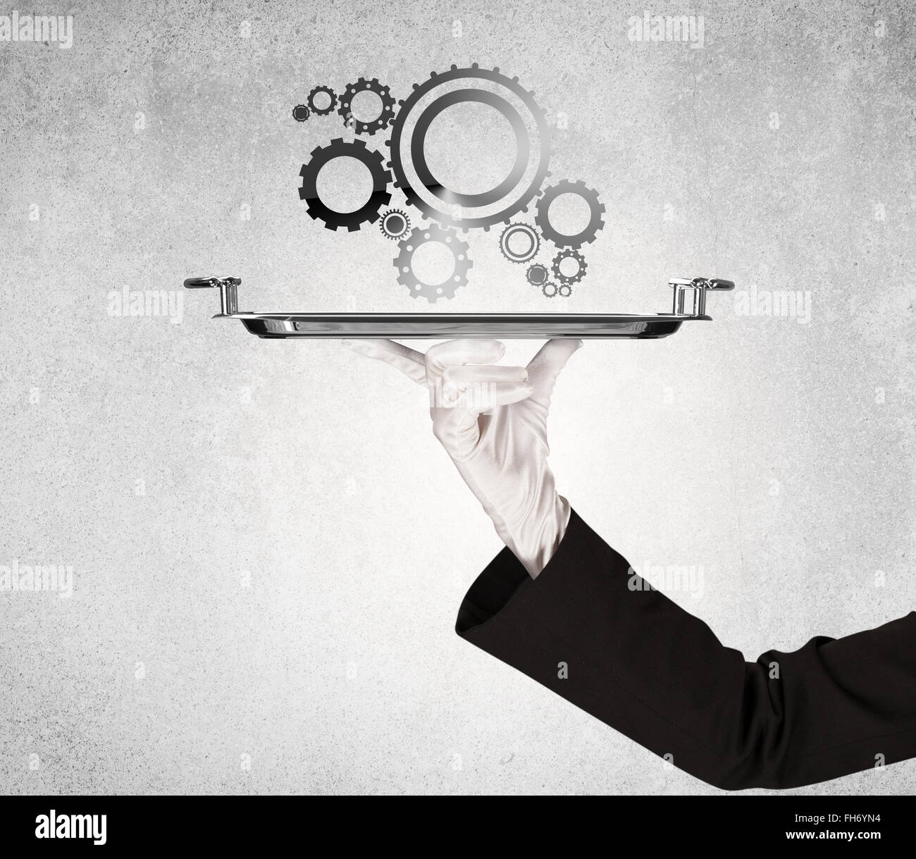 Working cog wheel concept on tray Stock Photo - Alamy