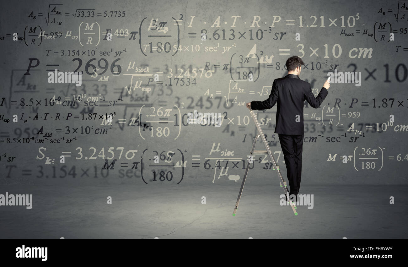 Man calculating from ladder Stock Photo - Alamy