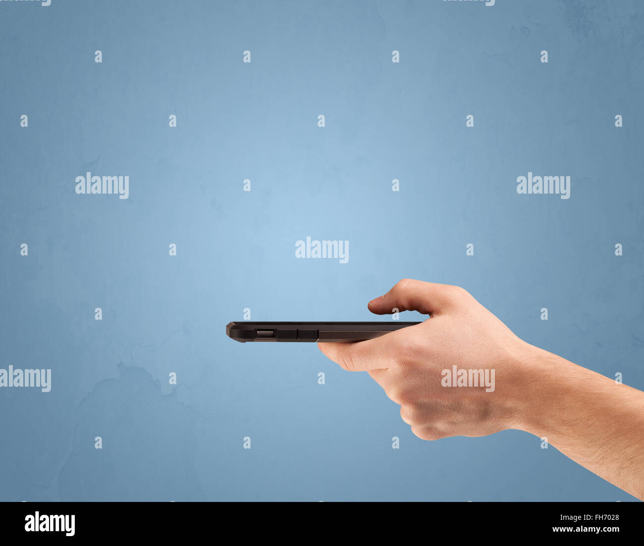 Holding telephone device from profile Stock Photo - Alamy