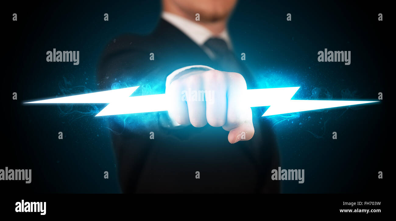 Hand holding lightning bolt hi-res stock photography and images - Alamy