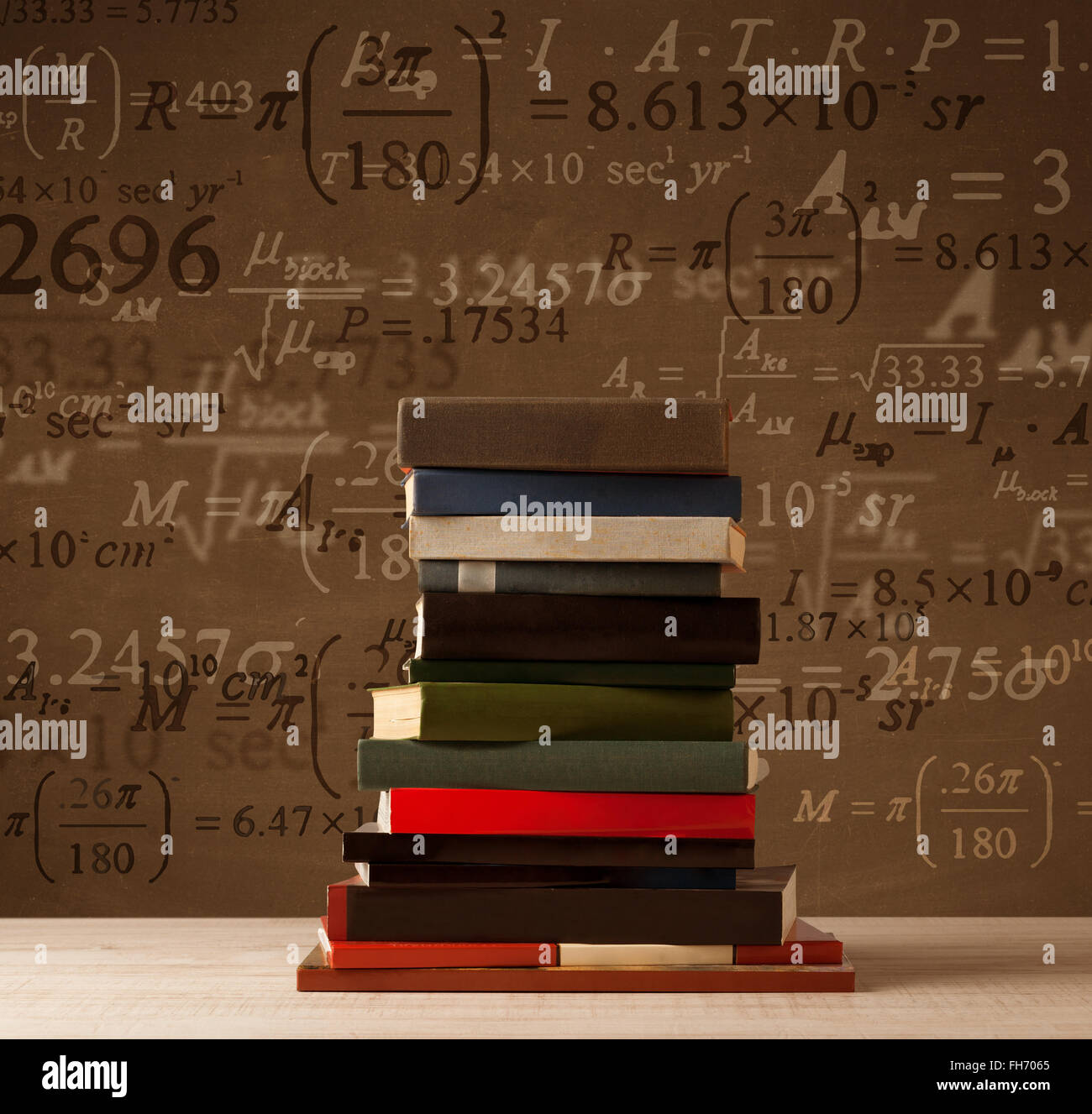 Books on vintage background with math formulas Stock Photo - Alamy