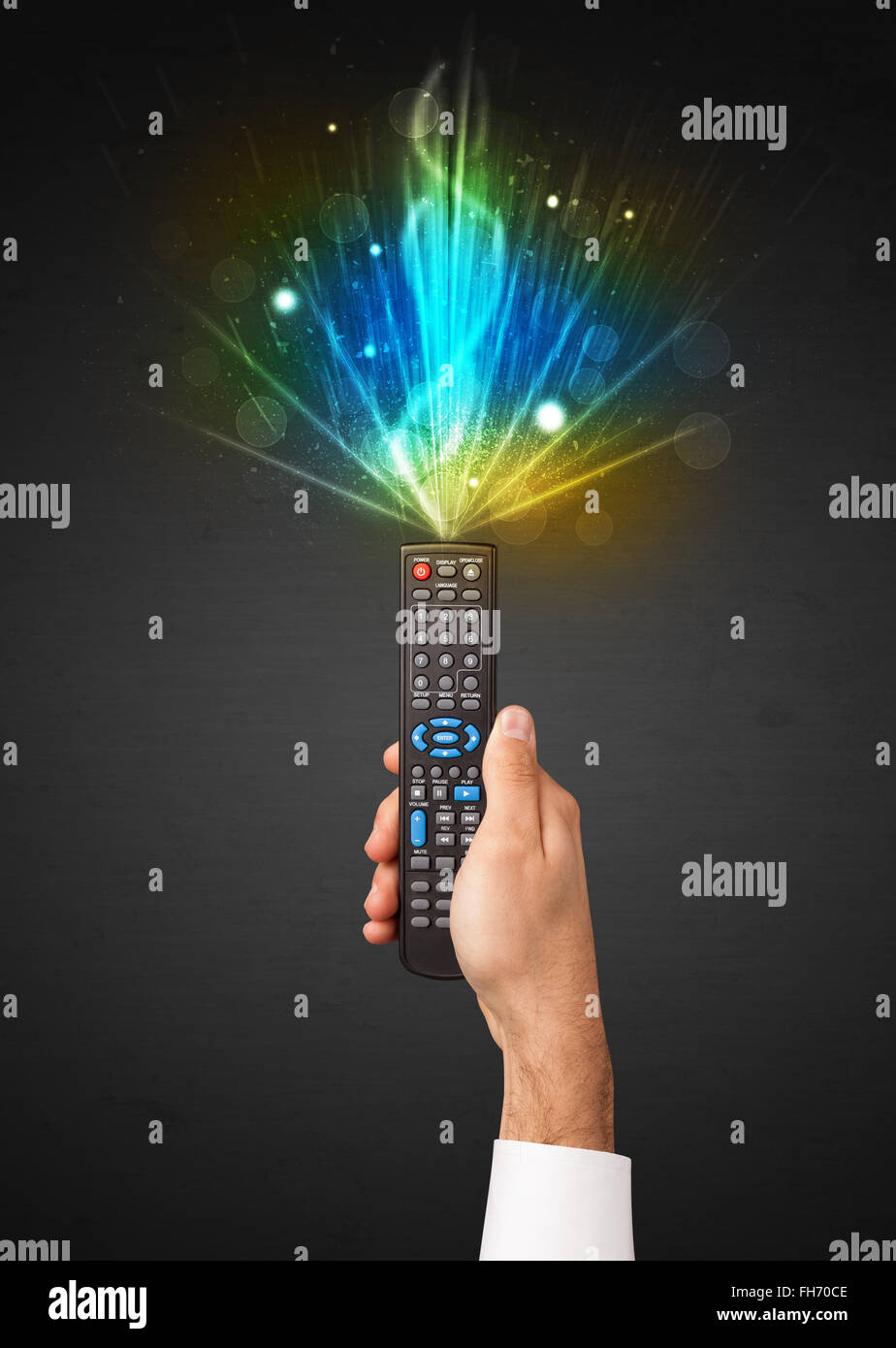 Hand with remote control and explosive signal Stock Photo - Alamy