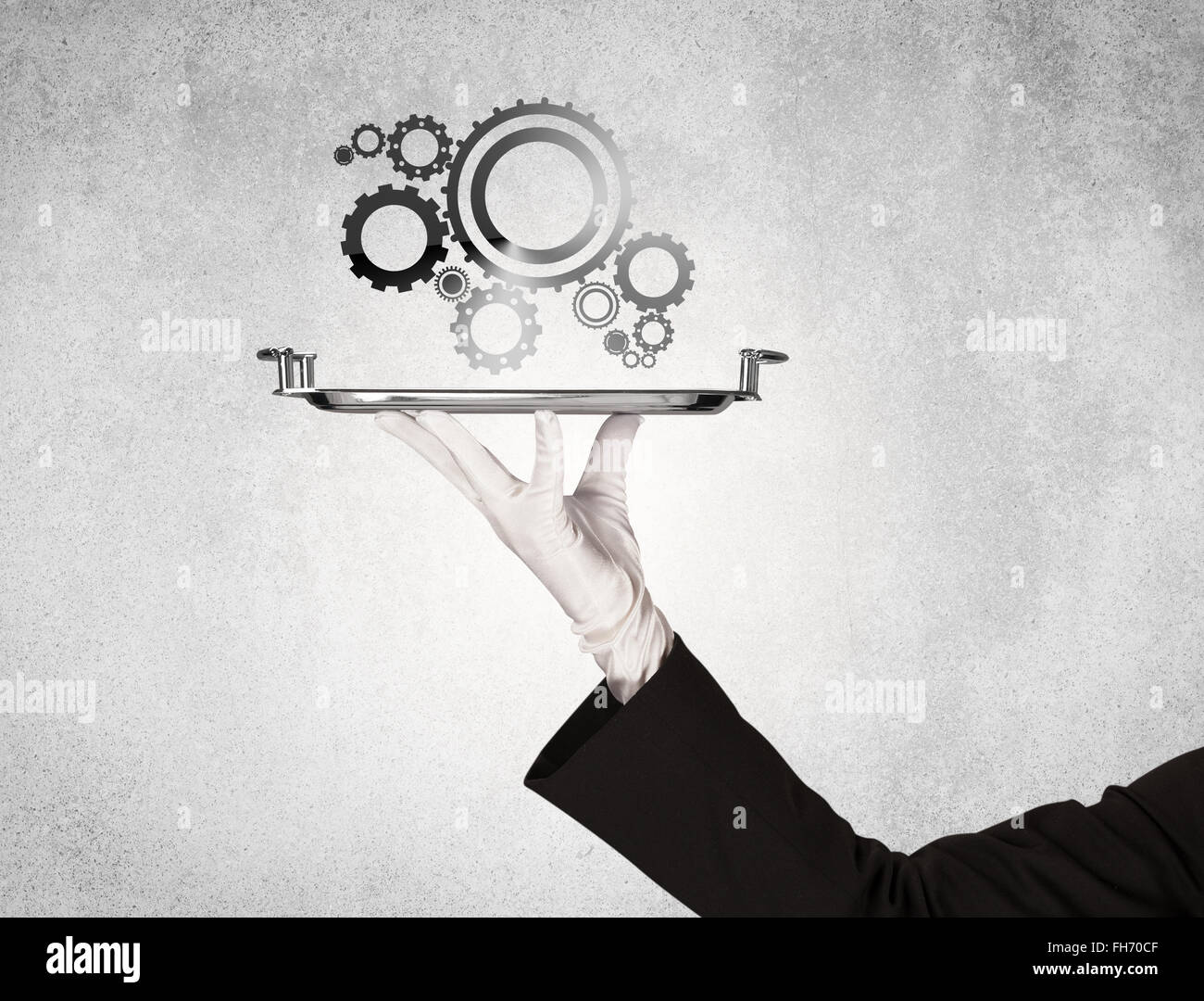 Working cog wheel concept on tray Stock Photo - Alamy