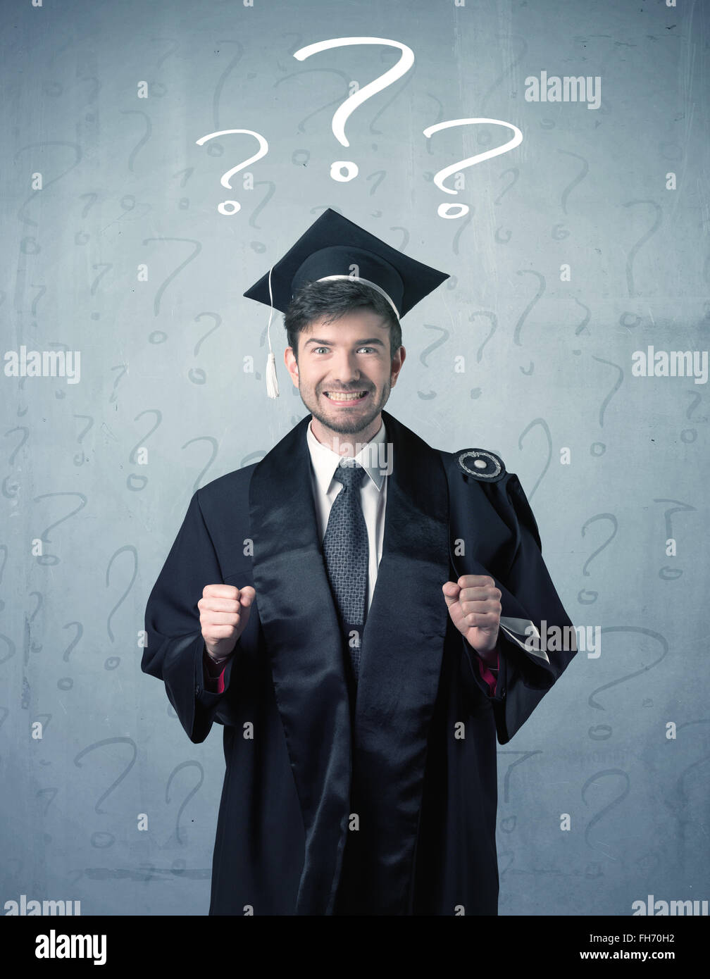 Young graduate teenager with question marks drawn Stock Photo - Alamy