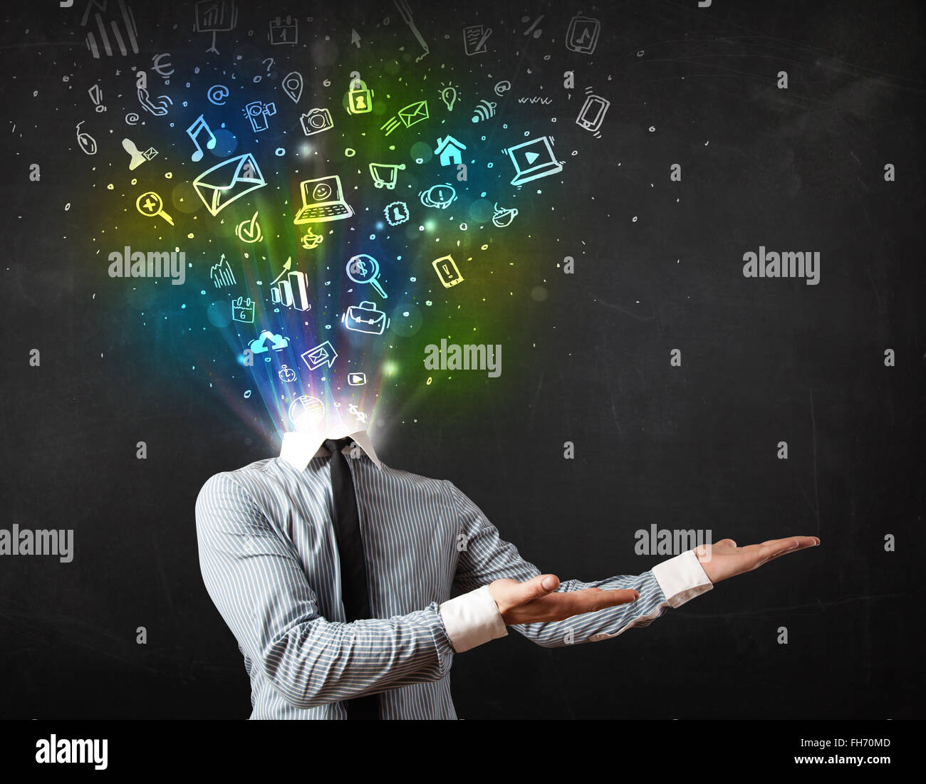Business man with glowing media icons exploding head Stock Photo - Alamy