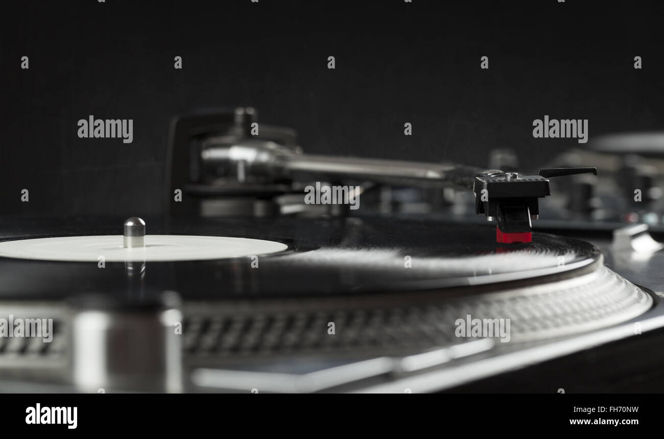 Turntable playing vinyl close up with needle on the record Stock Photo ...