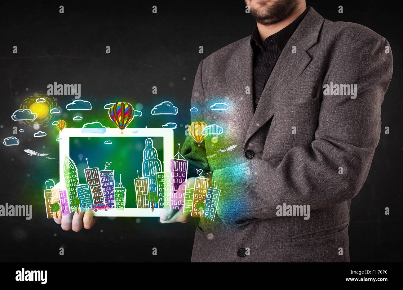 Young person showing tablet with hand drawn cityscape Stock Photo - Alamy