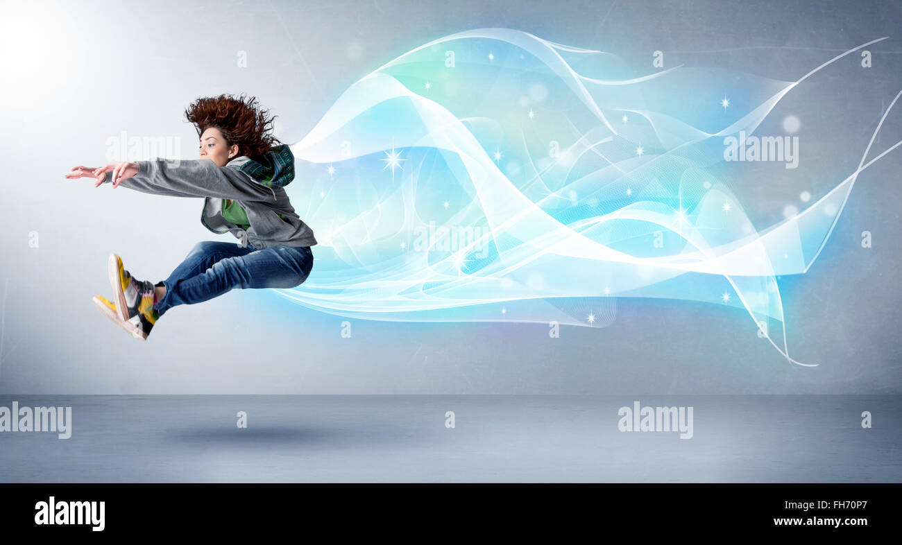 Cute teenager jumping with abstract blue scarf around her Stock Photo ...