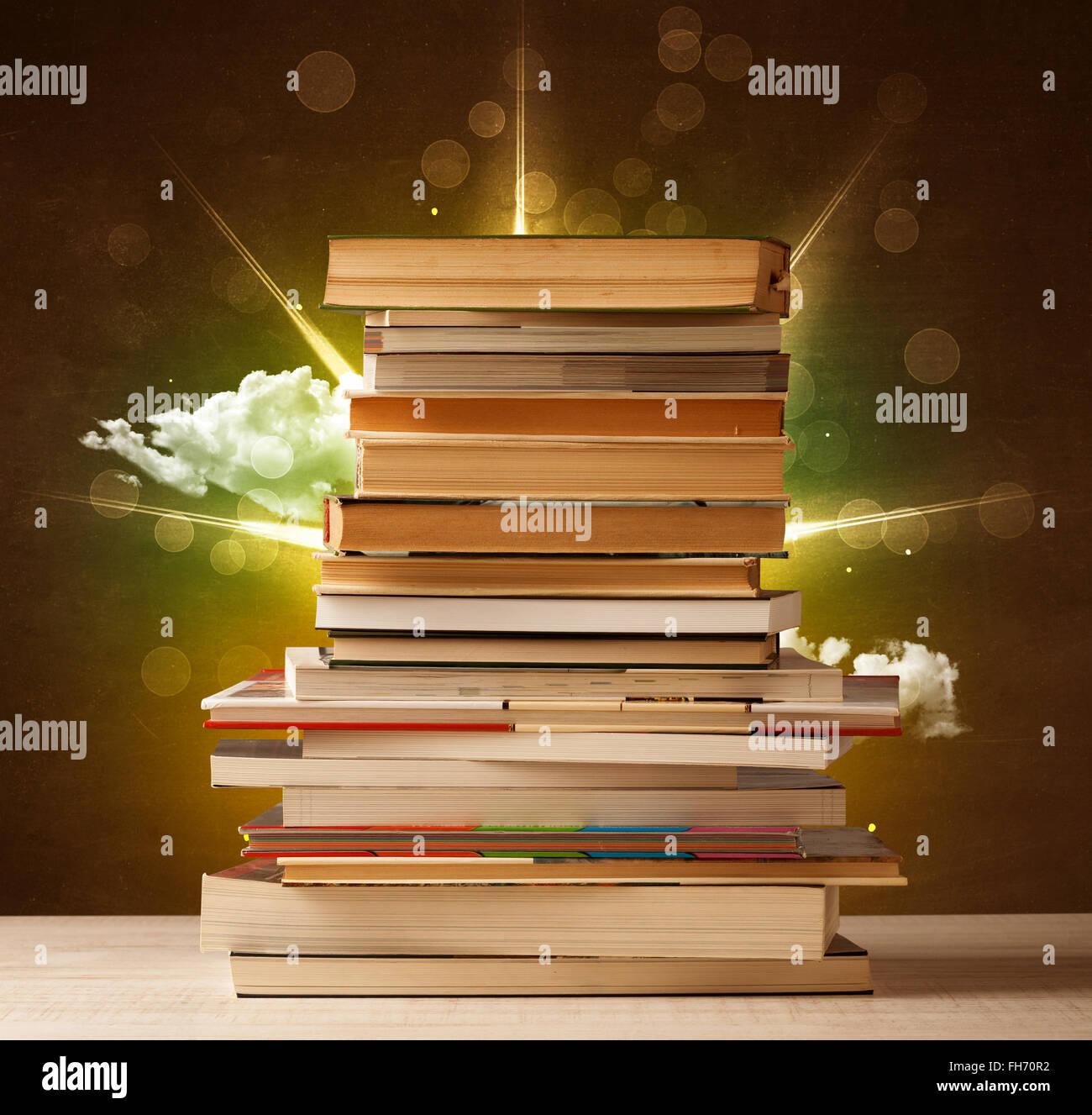 Magical books with ray of magical lights and colorful clouds Stock ...