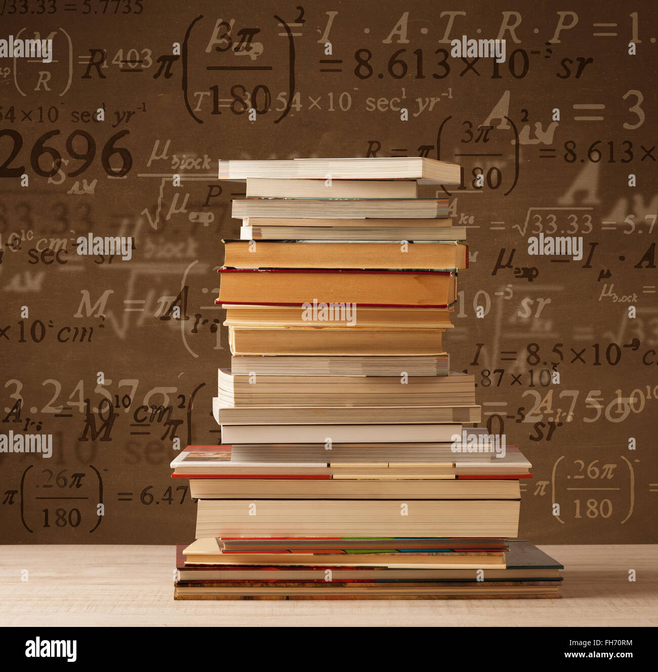 Books on vintage background with math formulas Stock Photo - Alamy