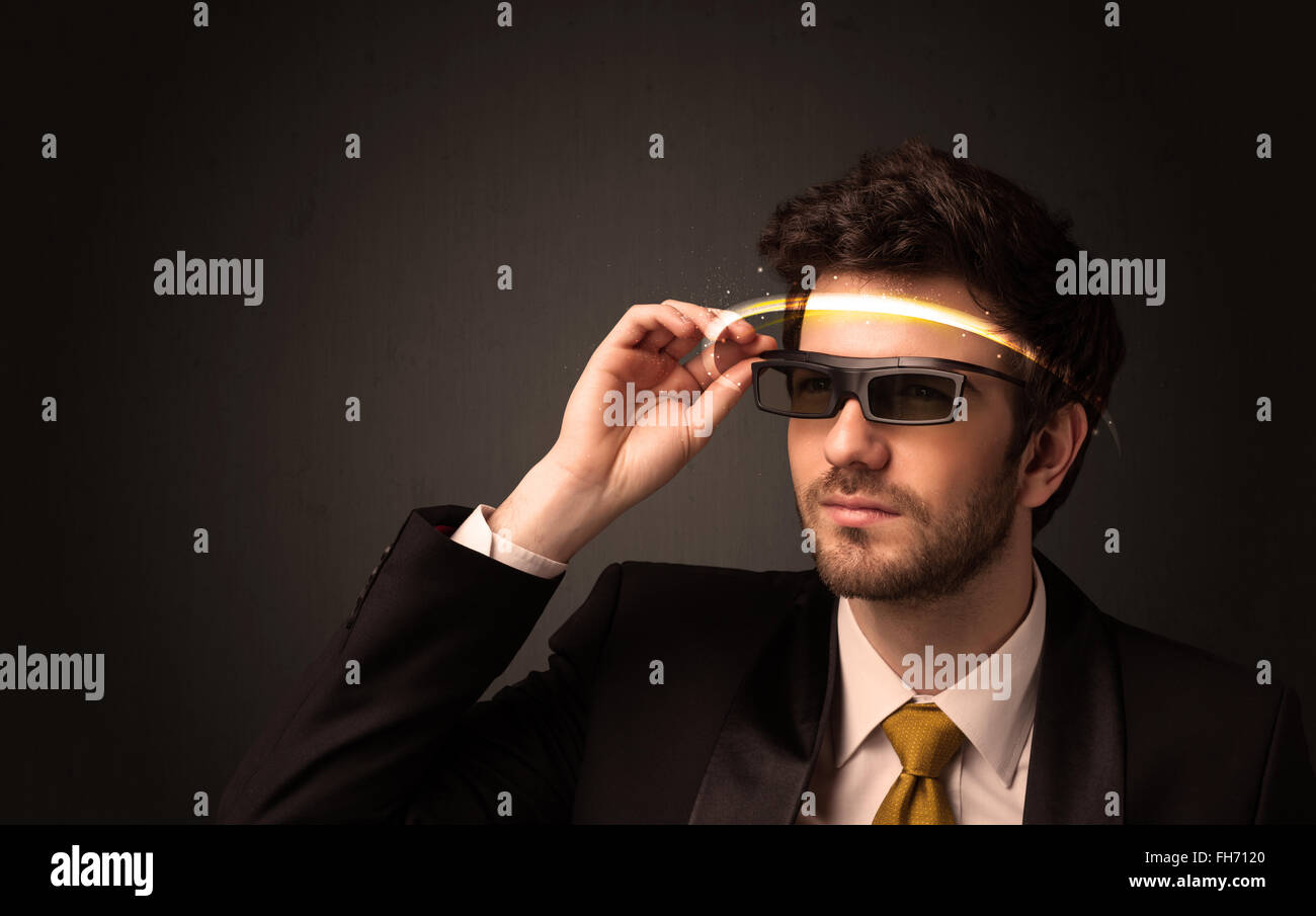 Handsome man looking with futuristic high tech glasses Stock Photo - Alamy