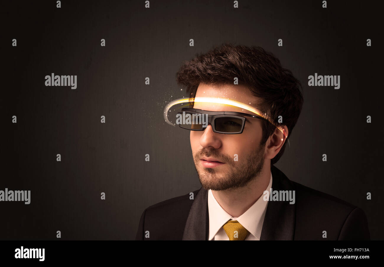 Handsome man looking with futuristic high tech glasses Stock Photo - Alamy