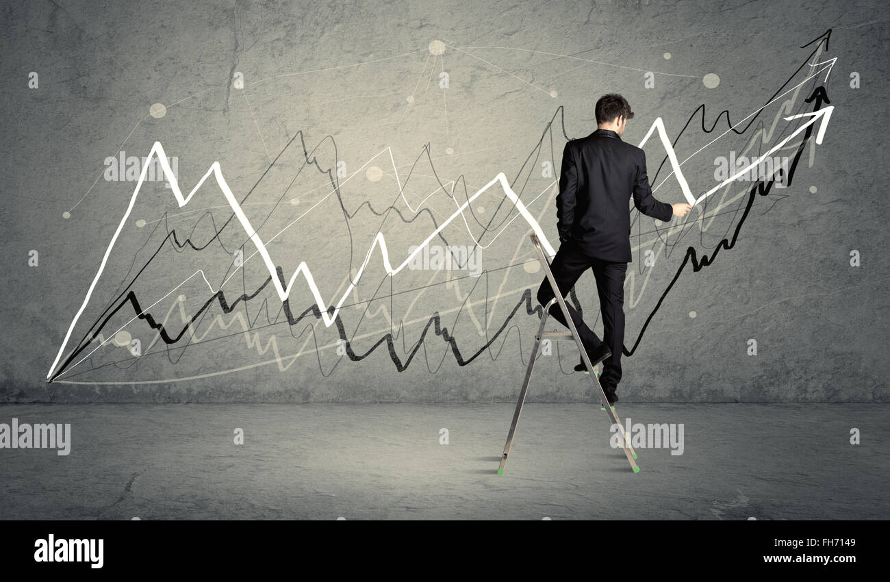 Man on ladder drawing lines Stock Photo - Alamy
