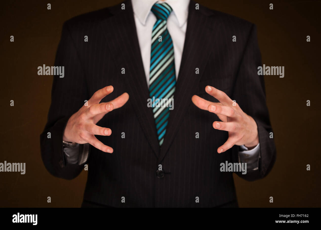 Businessman holding something Stock Photo - Alamy