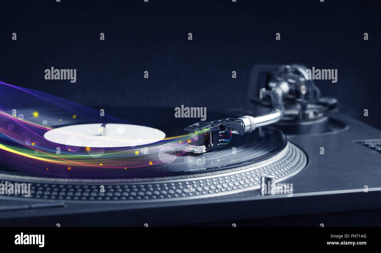 Turntable playing vinyl with glowing abstract lines Stock Photo - Alamy