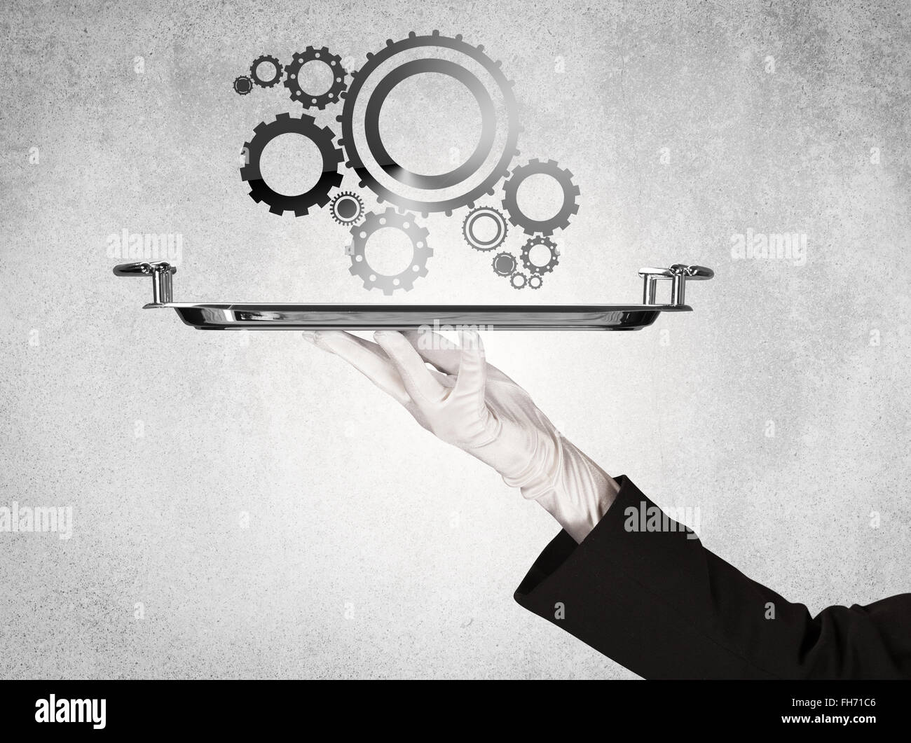 Working cog wheel concept on tray Stock Photo - Alamy