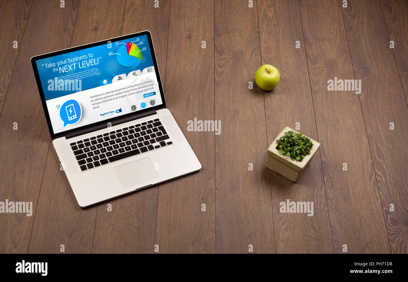 Laptop on office desk with business website on screen Stock Photo - Alamy