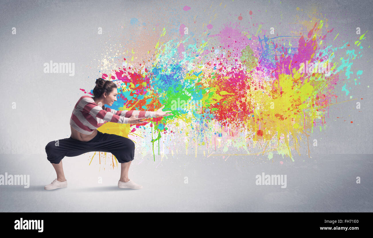 Young colorful street dancer with paint splash Stock Photo - Alamy