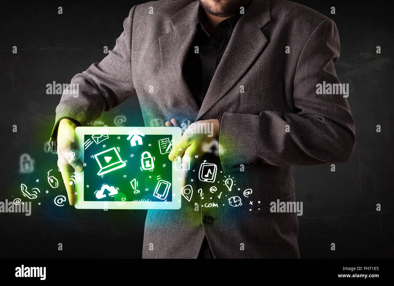 Person holding tablet with green media icons and symbols Stock Photo ...