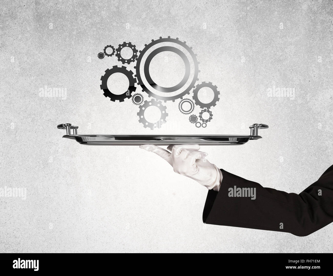Working cog wheel concept on tray Stock Photo - Alamy
