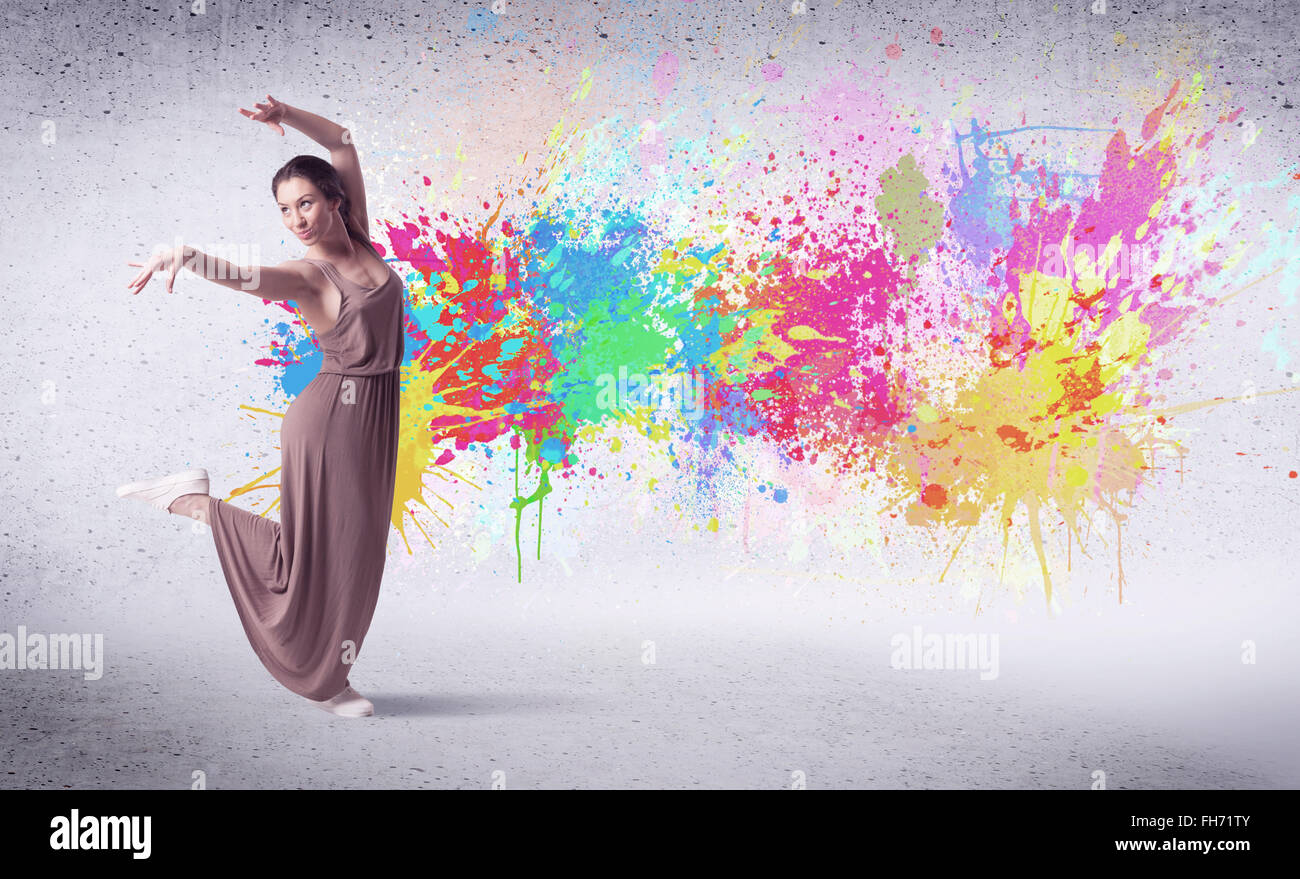 Modern street dancer jumping with colorful paint splashes Stock Photo ...