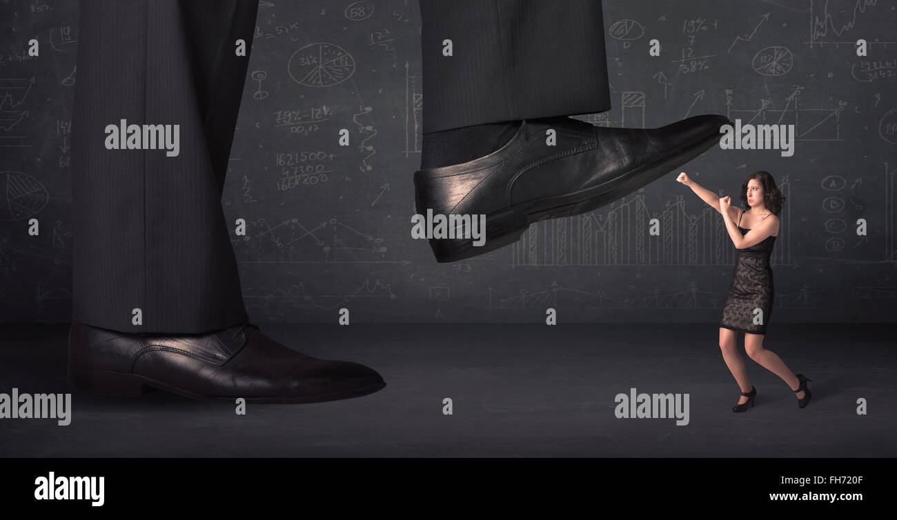 Huge leg stepping on a tiny businnesswoman concept Stock Photo - Alamy