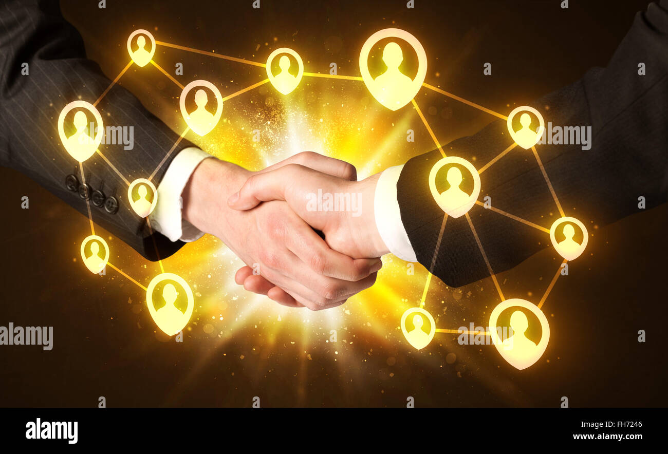 Social netwok connection handshake Stock Photo - Alamy