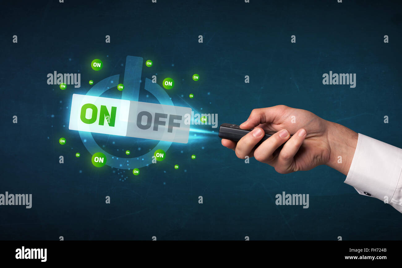 Hand with remote control and on-off signals Stock Photo - Alamy