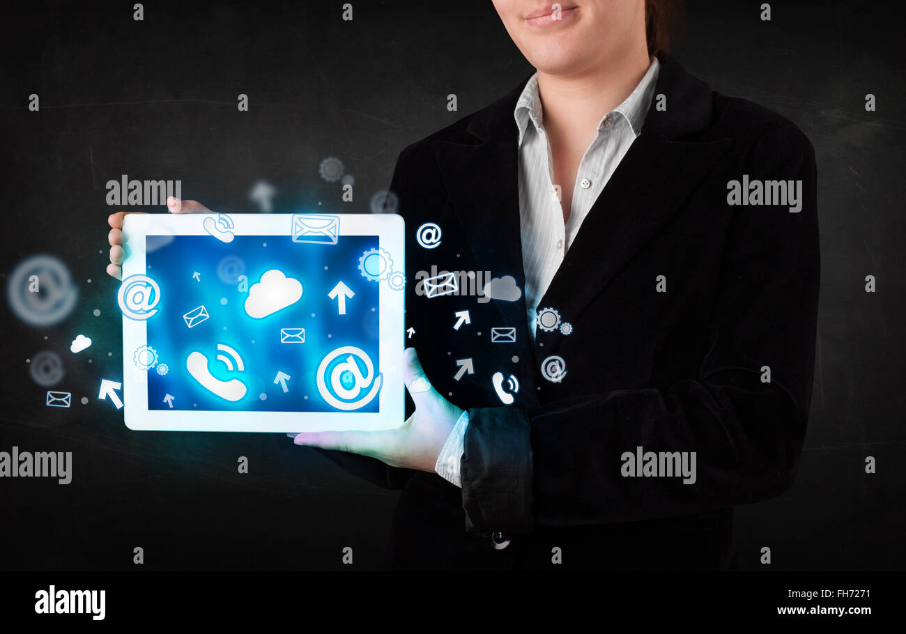 Person holding a tablet with blue technology icons and symbols Stock ...
